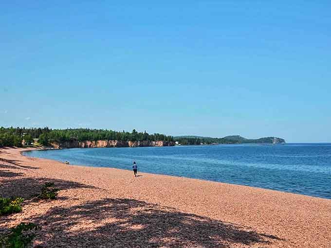 Stretching like a pink ribbon against Lake Superior's blue canvas, Iona's Beach offers a geological masterpiece that stops visitors in their tracks.