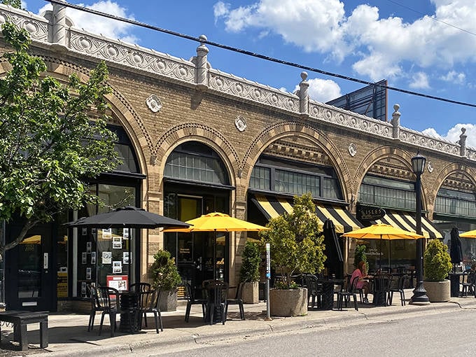 Those black and yellow awnings aren't just charming, they're basically saying "happiness lives here, come on in."