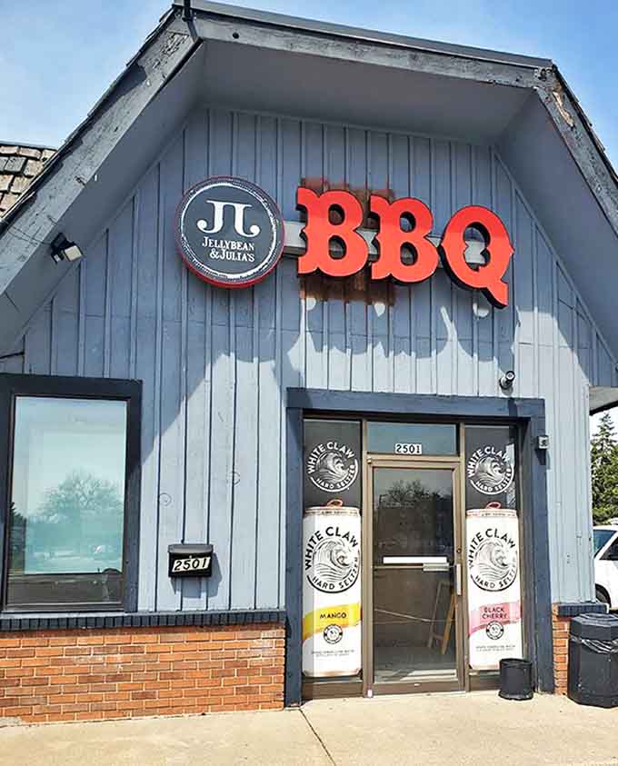 The blue-sided building with bold red "BBQ" letters promises smoky treasures within &ndash; a barbecue beacon in Coon Rapids.