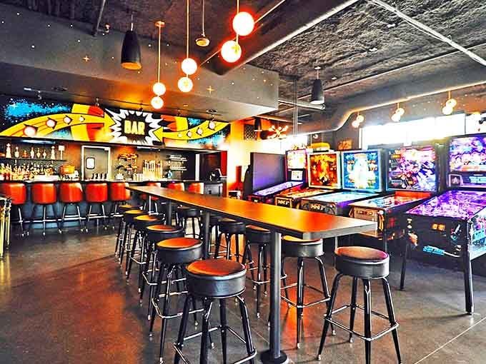 LITT Pinball Bar's exterior sign glows like a beacon for fun-seekers, promising nostalgic thrills and modern delights inside.