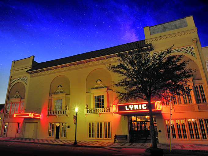 The Lyric Theatre's fa&ccedil;ade glows like a beacon of culture against the night sky, its vintage marquee promising an evening of enchantment in downtown Stuart.