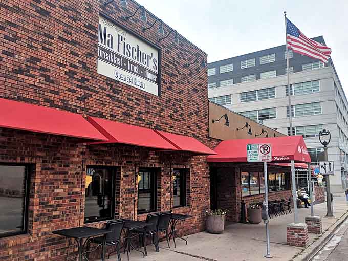 Ma Fischer's brick exterior with its signature red awnings stands as a beacon of comfort food in Milwaukee's East Side neighborhood.