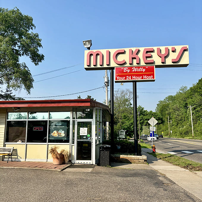 The iconic Mickey's Diner sign stands proud against the Minnesota sky, a beacon of comfort food that's been guiding hungry travelers for generations.
