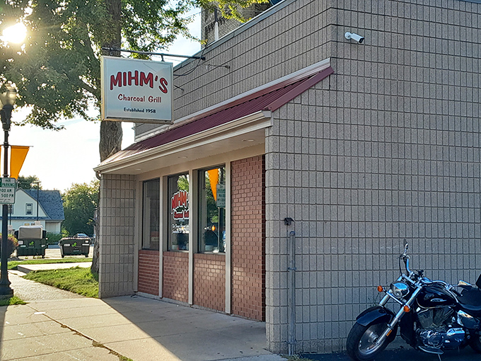 Mihm's Charcoal Grill stands proudly on its Menasha corner, the modest exterior hiding Wisconsin's burger paradise within. Established 1958, it's a time capsule of flavor.