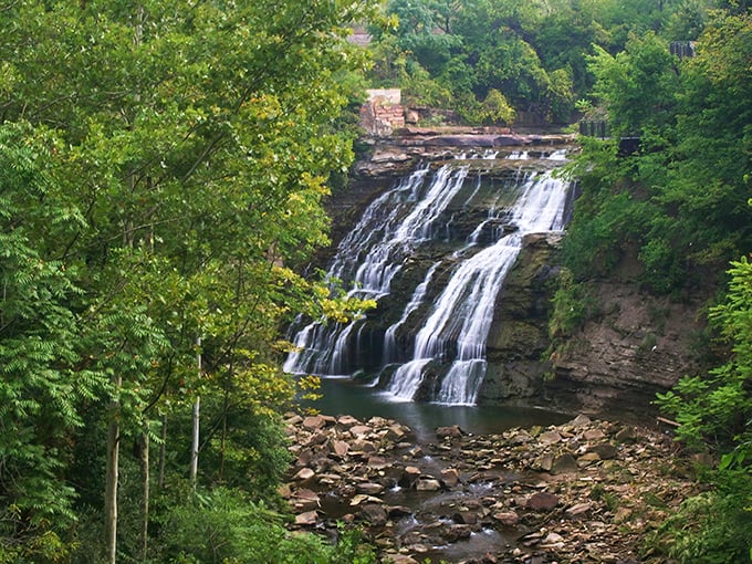 Mill Creek Falls cascades 48 feet down dramatic rock ledges, creating Cleveland's tallest waterfall and a symphony of splashing water.