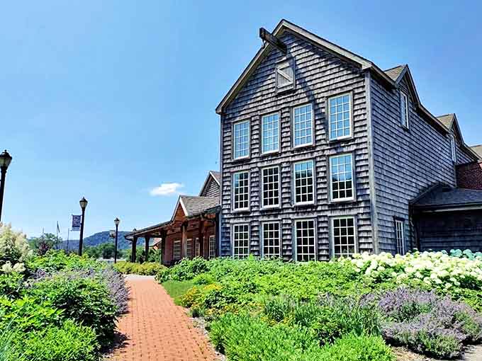 Exterior: The weathered cedar-shingled facade stands proudly against Minnesota's sky, channeling New England maritime charm in the most unexpected Midwestern setting.
