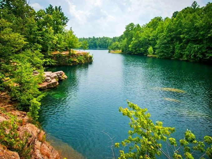 Nature's perfect canvas: turquoise waters framed by ancient sandstone cliffs create a scene that belongs on a travel magazine cover, not hidden in northeastern Ohio.