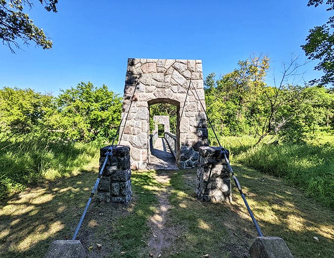 Stone archway standing sentinel at Old Mill State Park &ndash; where history and nature shake hands in a timeless Minnesota greeting.