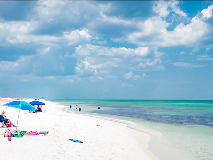Opal Beach stretches out like nature's welcome mat, where powdery white sand meets water so blue it seems digitally enhanced.