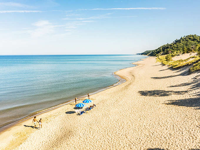 Oval Beach stretches out like nature's own infinity pool, where Lake Michigan meets sand so soft it feels like walking on powdered sugar with better scenery.