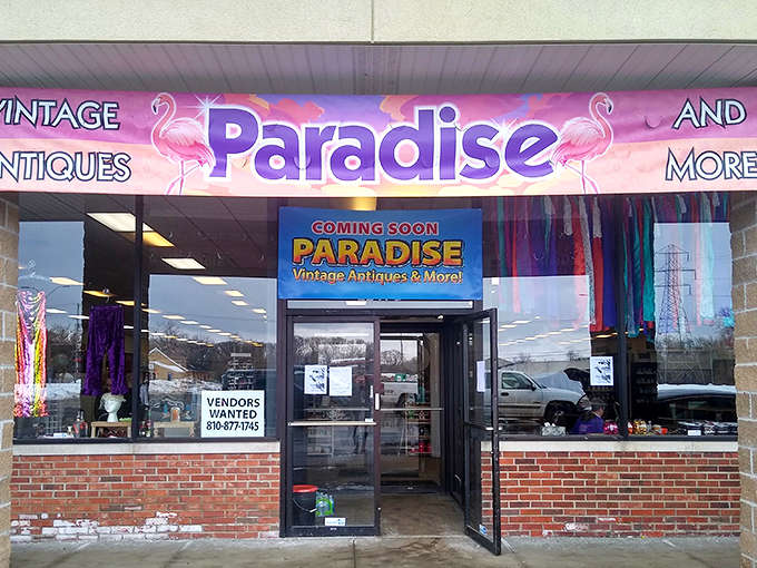 The vibrant flamingo-adorned storefront beckons treasure hunters into Paradise Vintage, where nostalgia comes packaged in a brick-and-mortar time machine.