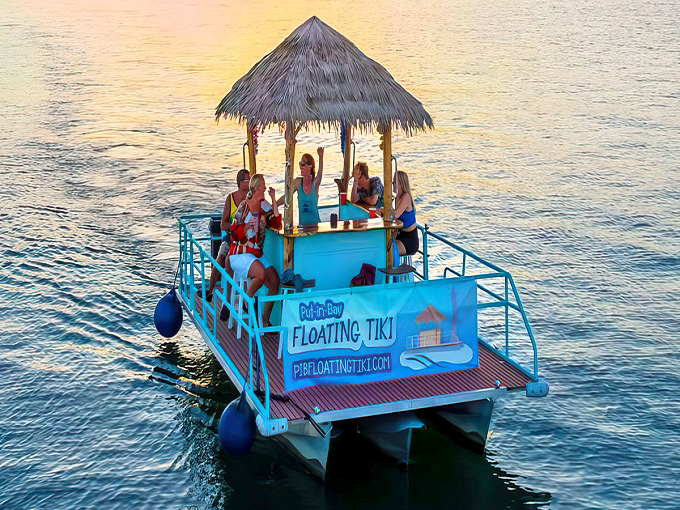 Paradise found! The turquoise-trimmed floating tiki bar glides across Lake Erie's waters, bringing tropical vibes to Ohio's favorite island getaway.