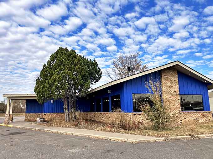 The iconic blue exterior of R.J. Riches stands proudly under Minnesota skies, promising breakfast adventures that defy both expectations and plate sizes.