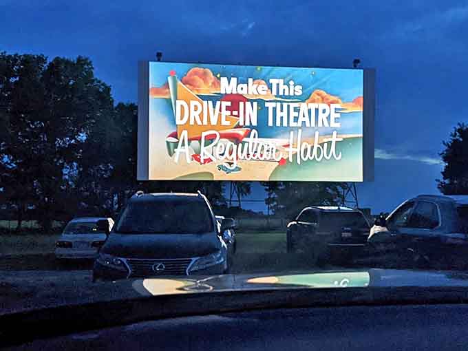 The iconic Route 66 Drive-In marquee glows against the twilight sky, promising an evening of nostalgia and cinematic magic for Springfield moviegoers.