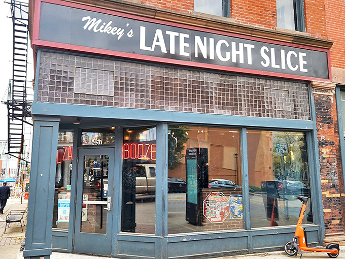 The Sacred Palm's entrance beckons with mysterious neon glow &ndash; Columbus' worst-kept secret hides in plain sight, promising cocktail adventures beyond the pizza realm.