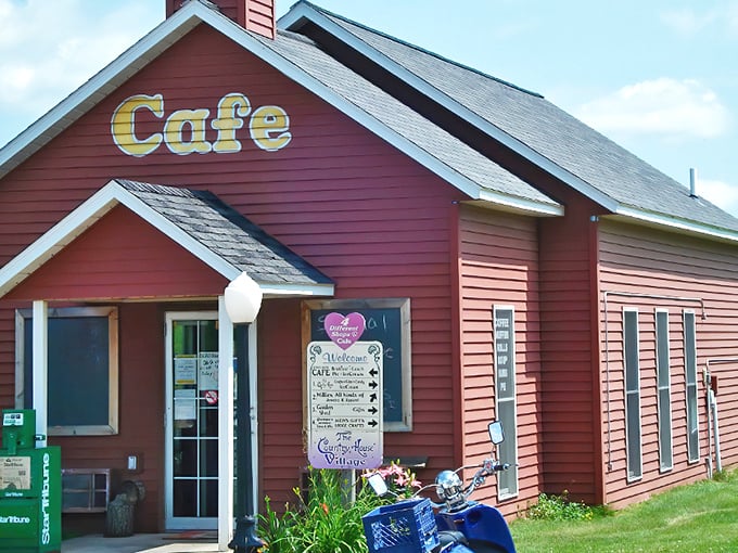 The crimson schoolhouse stands proudly against the Minnesota sky, its "Cafe" sign promising delicious lessons in comfort food that no traditional classroom could teach.