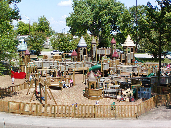 Sherlock Forest's wooden wonderland stretches across the landscape, a medieval village magically transported to Minnesota's heartland.