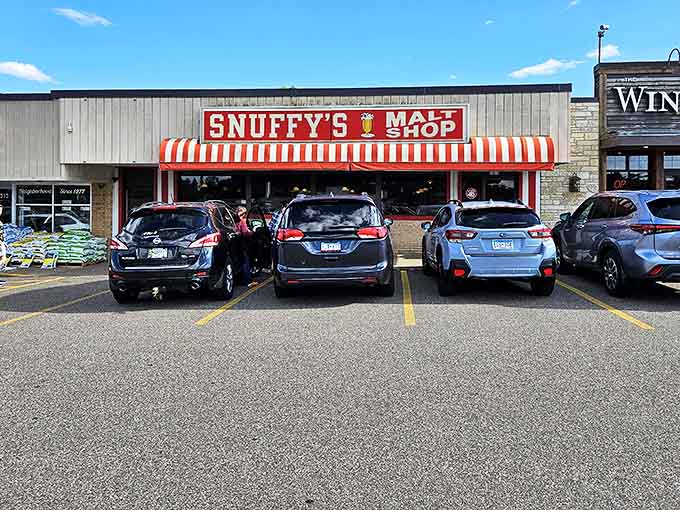 The iconic red and white awning of Snuffy's beckons hungry visitors like a beacon of burger bliss in Minnetonka.
