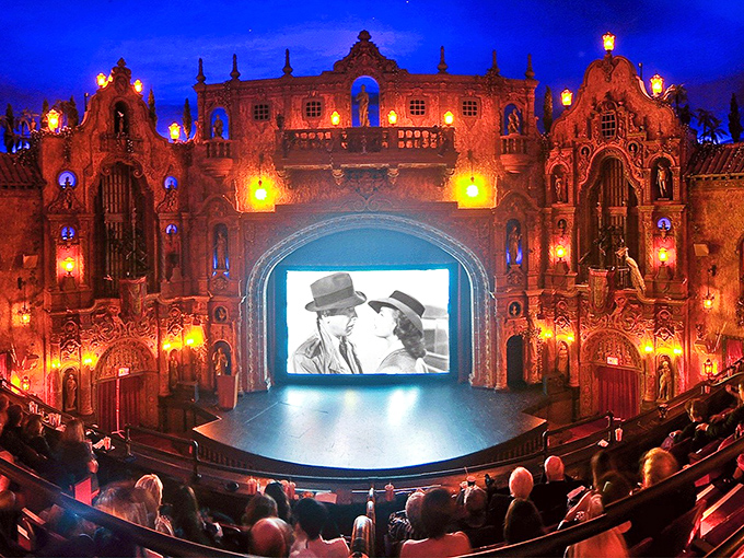 The iconic Tampa Theatre marquee glows against the twilight sky, beckoning cinephiles and architecture lovers alike to step back in time.