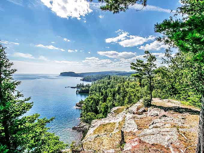 Nature's grandstand: Tettegouche's shoreline cliffs offer front-row seats to Lake Superior's endless blue horizon, where sky meets water in perfect harmony.