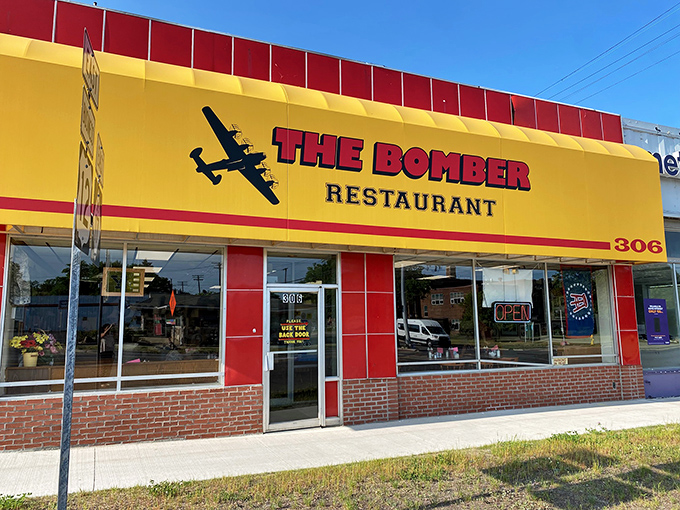 The unmistakable yellow and red exterior of The Bomber Restaurant &ndash; where history and hearty breakfasts have been taking flight since the mid-20th century.