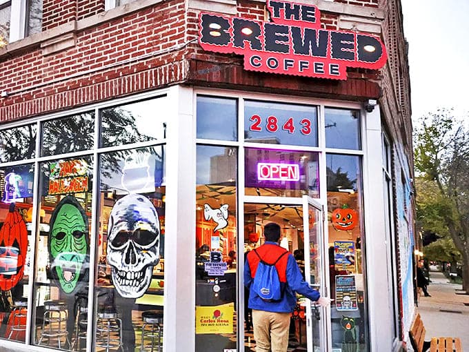 The brick corner building with its bold red "THE BREWED COFFEE" sign promises something far more intriguing than your average caffeine fix.