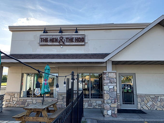 The Hen & The Hog's welcoming exterior promises comfort food magic within those stone-accented walls. Small town charm, big time flavors.