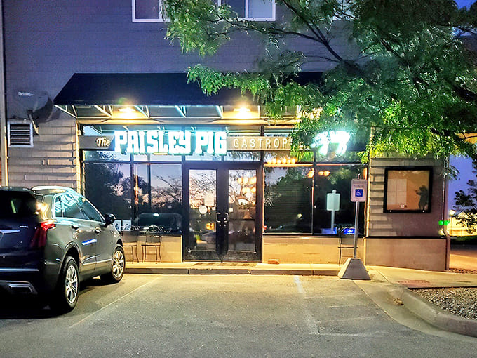 The Paisley Pig's inviting storefront glows warmly at dusk, beckoning hungry travelers like a lighthouse for the famished.