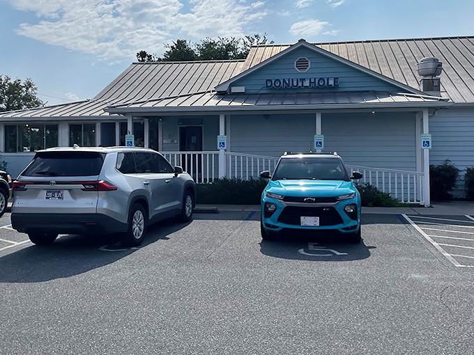 The welcoming blue exterior of Donut Hole beckons breakfast enthusiasts with its coastal charm and promise of morning delights.