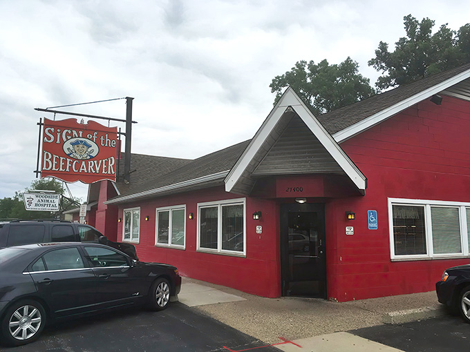 That cheerful red exterior isn't just paint, it's a promise of the warm, welcoming comfort food experience waiting inside this Royal Oak institution.