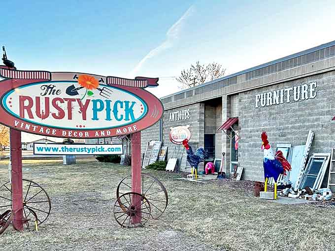 The iconic Rusty Pick sign, perched on vintage wagon wheels, promises adventures in antiquing that go beyond the ordinary.