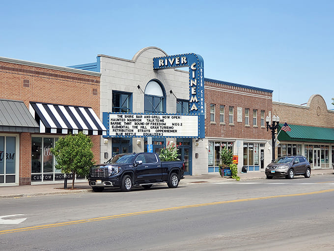 The iconic blue neon sign of River Cinema beckons movie lovers, hiding a culinary adventure that rivals any blockbuster plot twist.