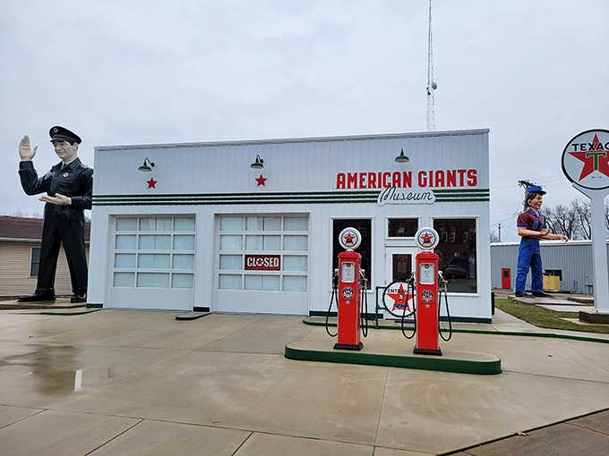 The American Giants Museum stands proudly in Atlanta, Illinois, its vintage service station facade flanked by towering guardians of roadside Americana.
