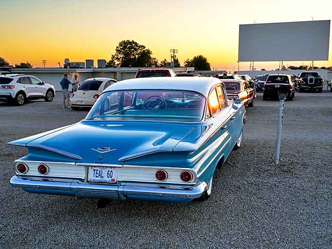 Route 66's Sky View Drive-In welcomes visitors with its classic blue Chevy, a perfect pairing of automotive and cinema nostalgia.