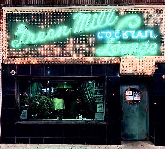 The iconic neon sign glows like a jazz-age beacon on Chicago's Broadway Avenue, promising musical magic within those weathered walls.