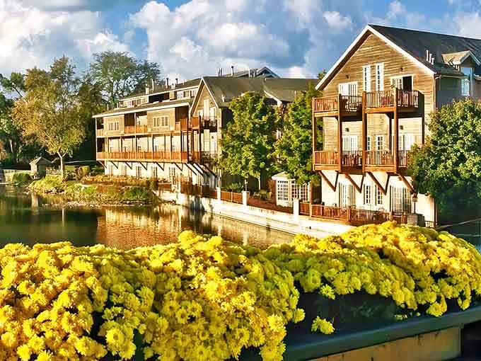 Riverside elegance meets Midwestern charm as the Herrington Inn's honey-colored fa&ccedil;ade reflects in the Fox River, wooden balconies inviting guests to linger.