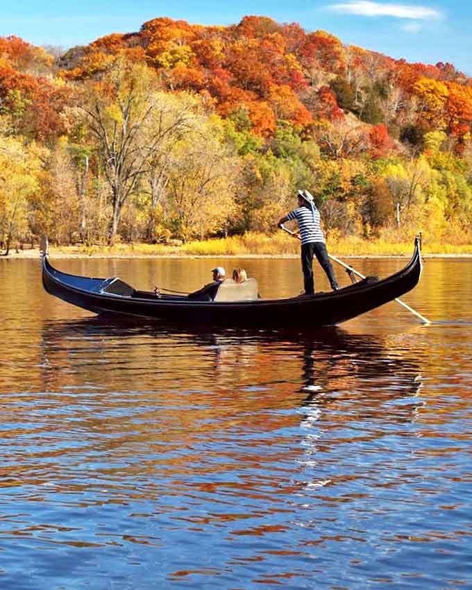 Autumn's fiery palette creates the perfect backdrop for Gondola Romantica's Venetian magic on the St. Croix River.