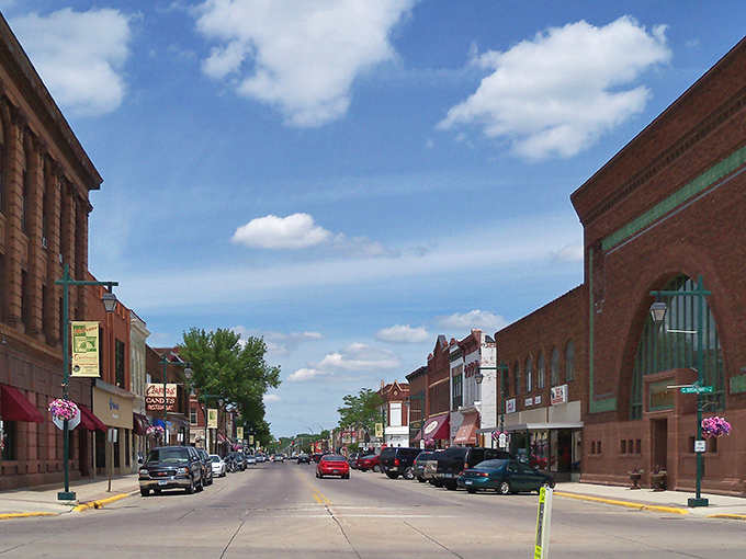 Owatonna's main street stretches toward the horizon like a ribbon of Americana, where brick buildings whisper stories of yesteryear.