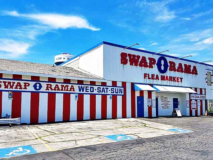 The iconic red and white striped exterior of Swap-O-Rama stands like a retail carnival, promising treasures within its patriotic walls.