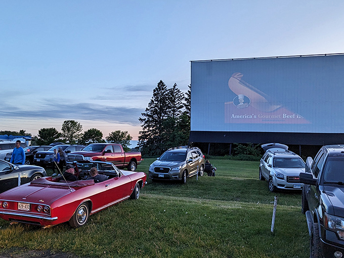 The iconic Starlite marquee stands proud against the Minnesota sky, a neon beacon calling movie lovers to gather under the stars.