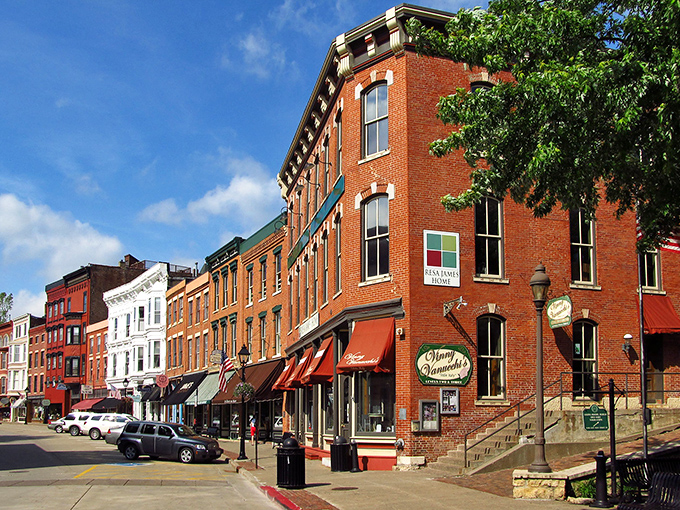 Red brick buildings stand shoulder to shoulder along Main Street, their 19th-century facades telling stories of a bygone era.
