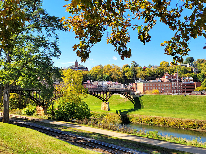 Galena's picturesque landscape unfolds like a painting, with its historic bridge arching gracefully over emerald fields and the winding river below.
