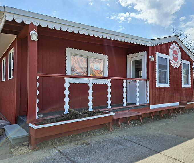 That charming red exterior with white gingerbread trim isn't just for show; it's your first hint that magic happens inside.