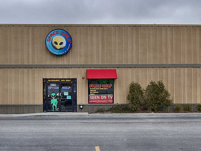 The unassuming exterior of Space Golf in Orland Park hides a universe of neon wonders within. That alien logo promises cosmic adventures await!