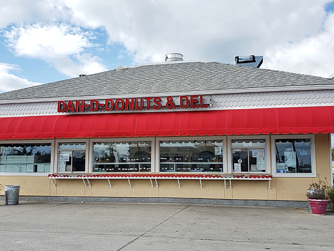 The iconic red awning of Dan-D-Donuts beckons hungry visitors with promises of sweet treasures within this Panama City landmark.