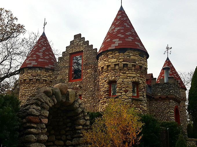 Stone towers with distinctive red-tiled roofs pierce the Illinois sky, creating a medieval mirage in suburban Chicago that stops first-time visitors in their tracks.