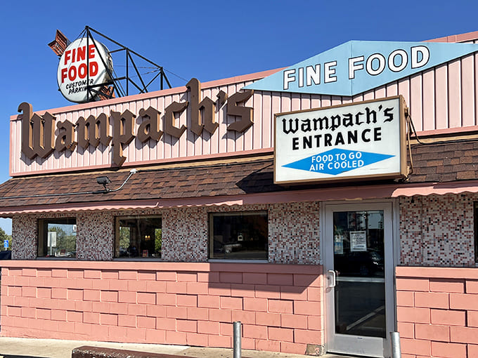 Wampach's pink exterior stands like a time capsule on Shakopee's streets, its vintage "FINE FOOD" sign promising delicious nostalgia within.