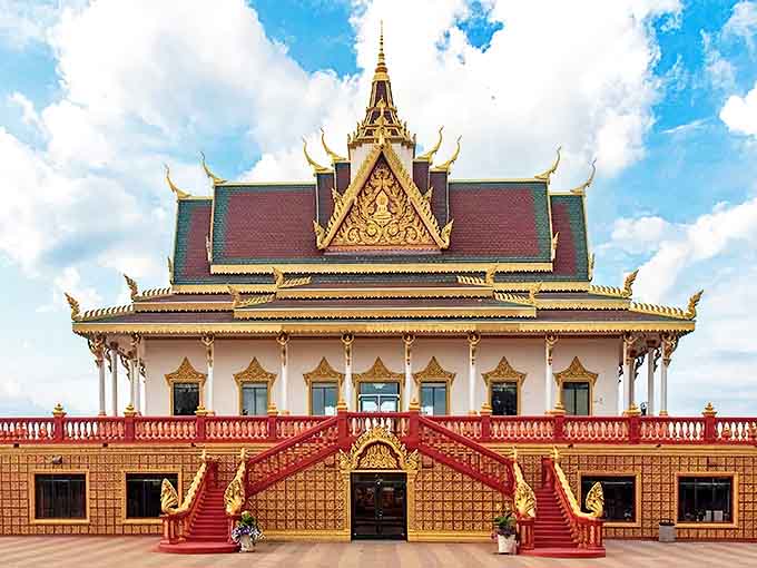 Watt Munisotaram stands like a Cambodian dream in Minnesota's landscape, its golden spires reaching skyward as if homesick for Southeast Asian skies.