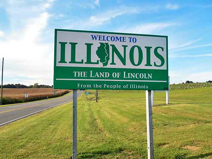 The iconic green welcome sign stands sentinel at Illinois borders, promising adventures beyond the highway for road-weary travelers.