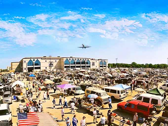 Wolff's Flea Market sprawls beneath blue skies where planes descend and bargain hunters ascend to treasure-hunting glory.